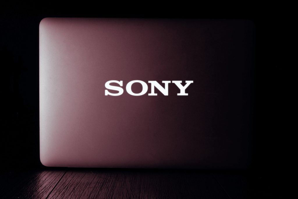 Laptop Glowing Logo Mockup – GraphicsFamily