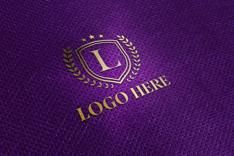 Gold Logo Mockup on Purple Fabric Texture – GraphicsFamily